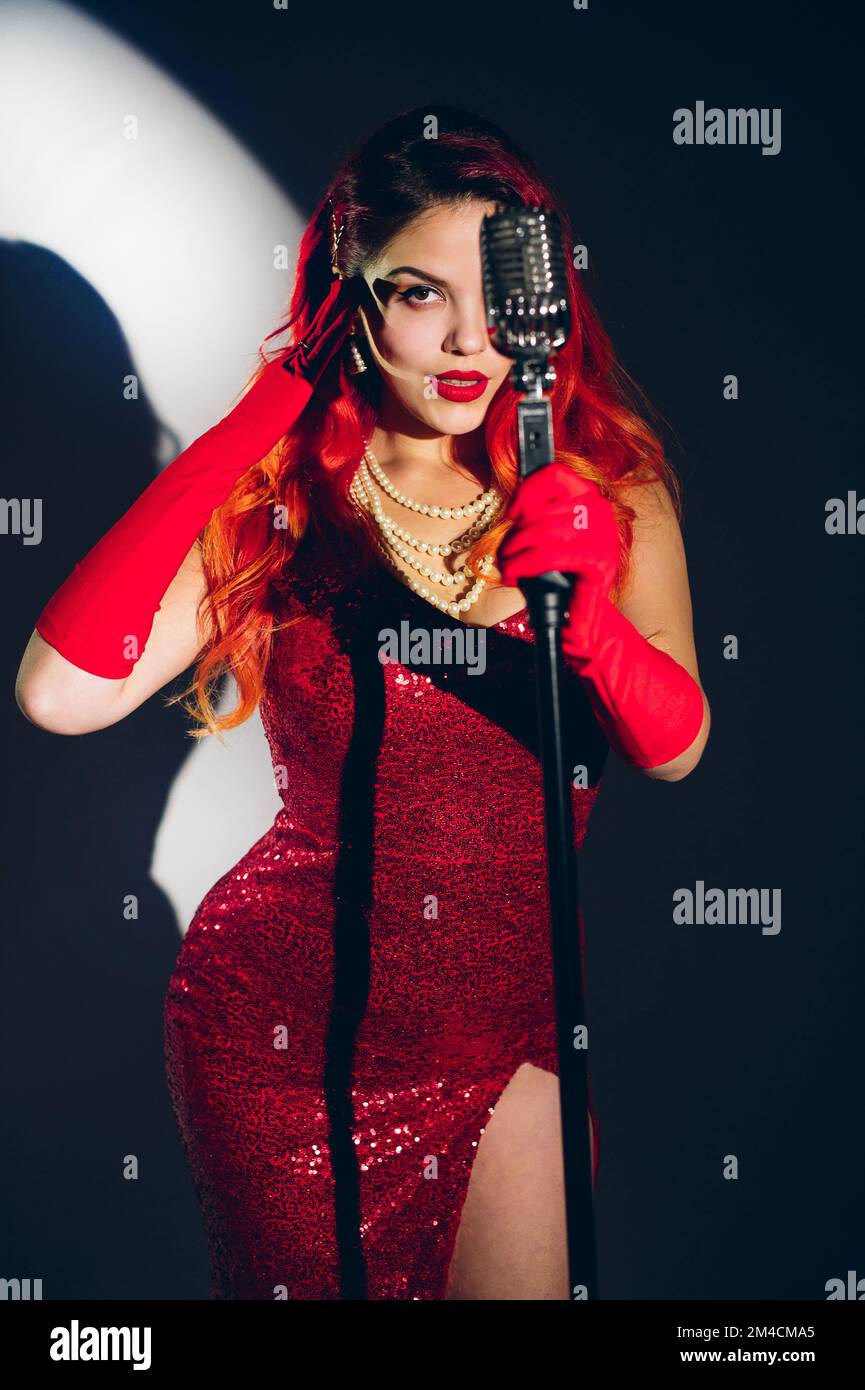 Female singer with red hair hi-res stock photography and images - Alamy