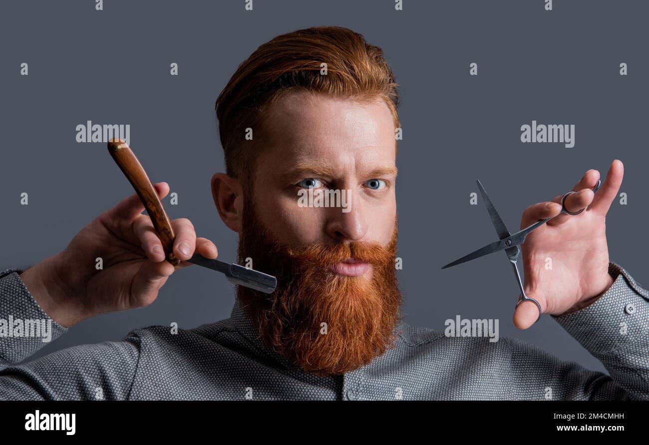 man barber with modern hairstyle isolated on grey background. man with ...