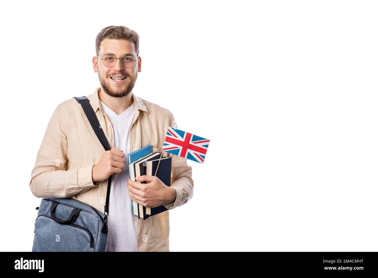 Handsome bearded student holding handbag, books and btitish flag ...