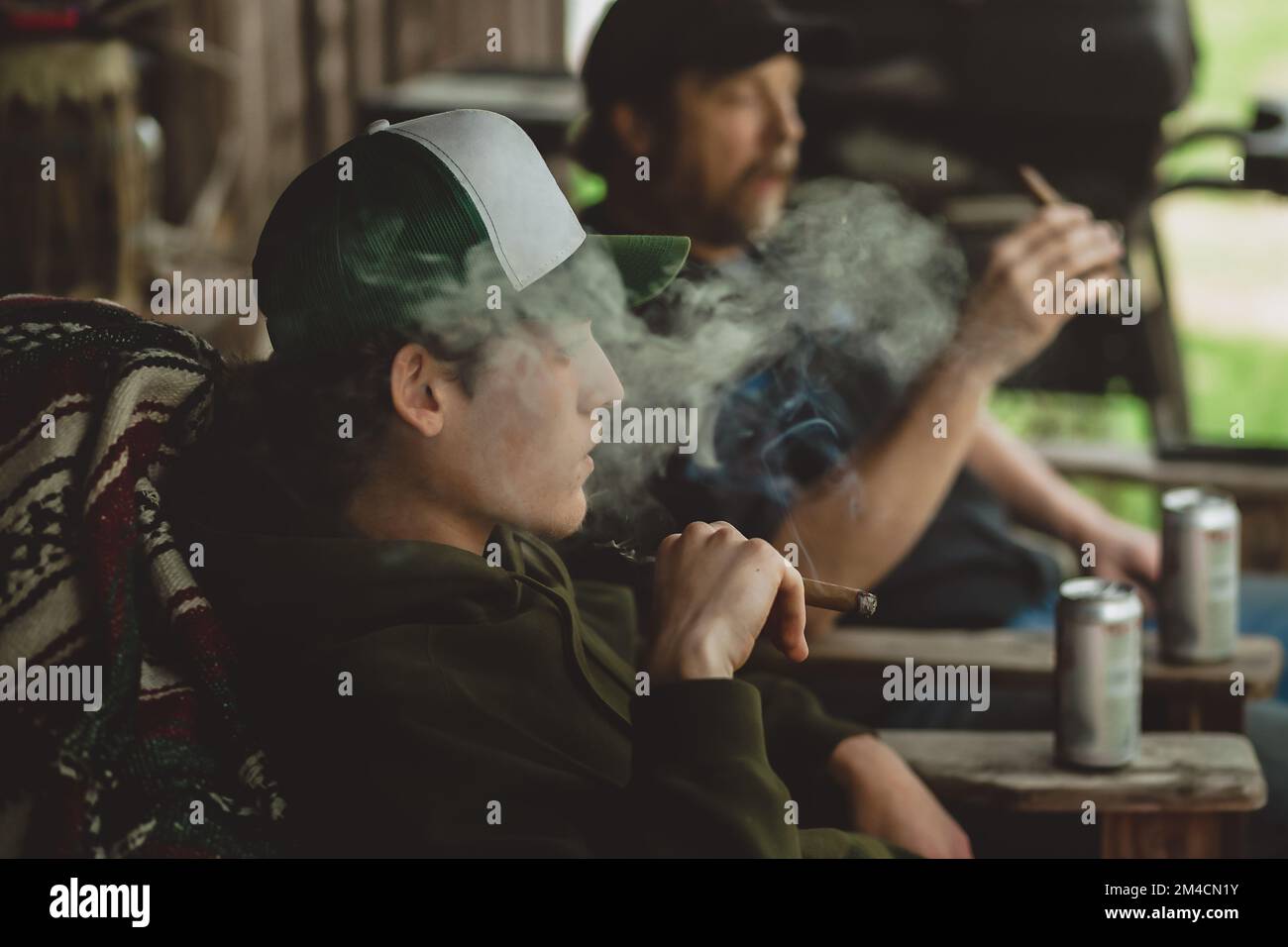 Young millenial man sitting hi-res stock photography and images - Alamy