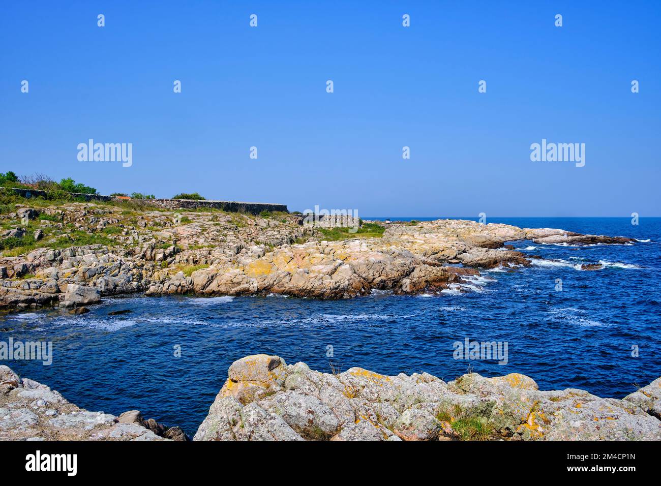 Out and about on the Ertholmen islands, rugged cliff coast to the East ...
