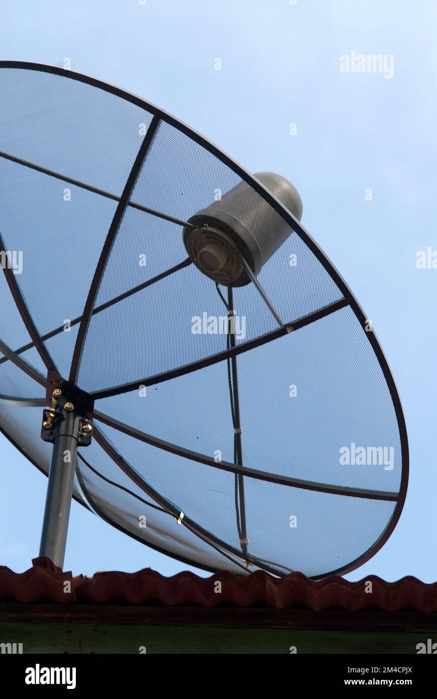 Big black satellite dish on roof Stock Photo - Alamy