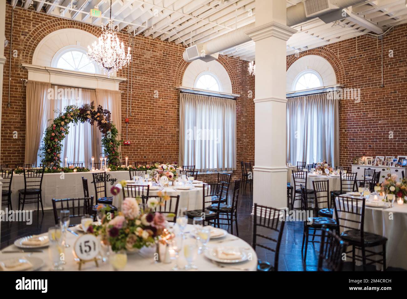 Photograph of modern hip wedding venue and table setup Stock Photo - Alamy