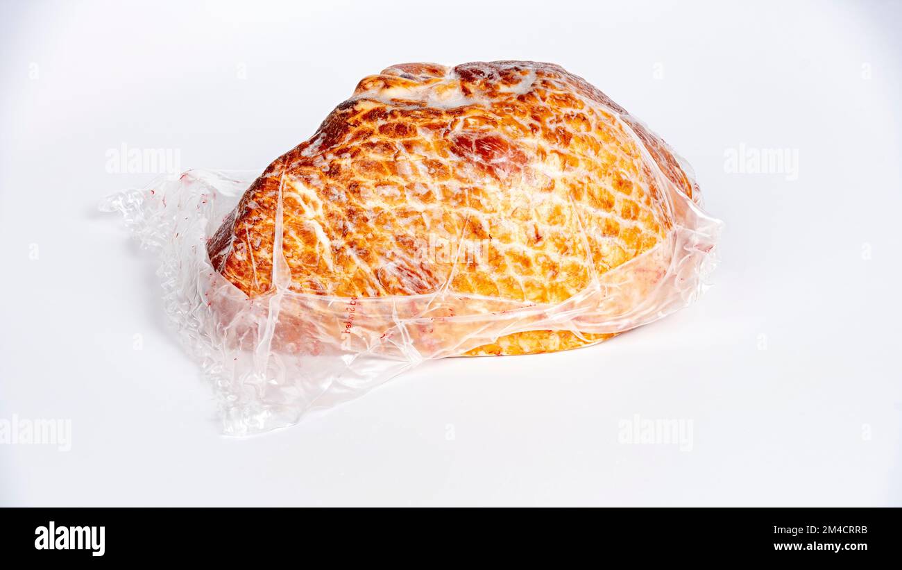 Plastic wrapped Ham in a frozen state Stock Photo - Alamy