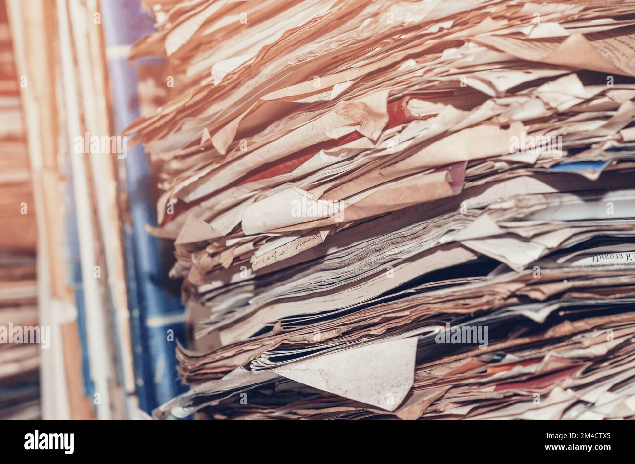 Documents, old papers in folders on shelves are stacked in a mess Stock ...