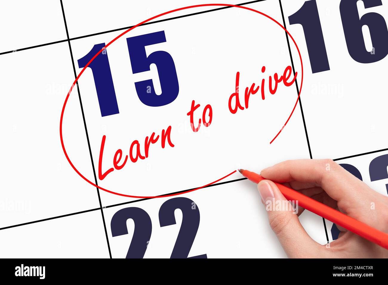 15th day of the month. Hand writing text LEARN TO DRIVE on calendar ...