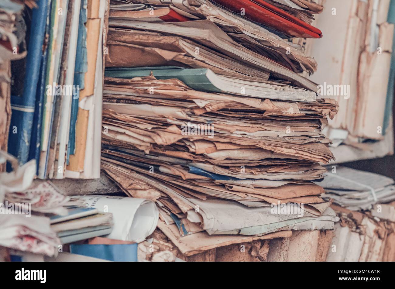 Documents, old papers in folders on shelves are stacked in a mess Stock ...