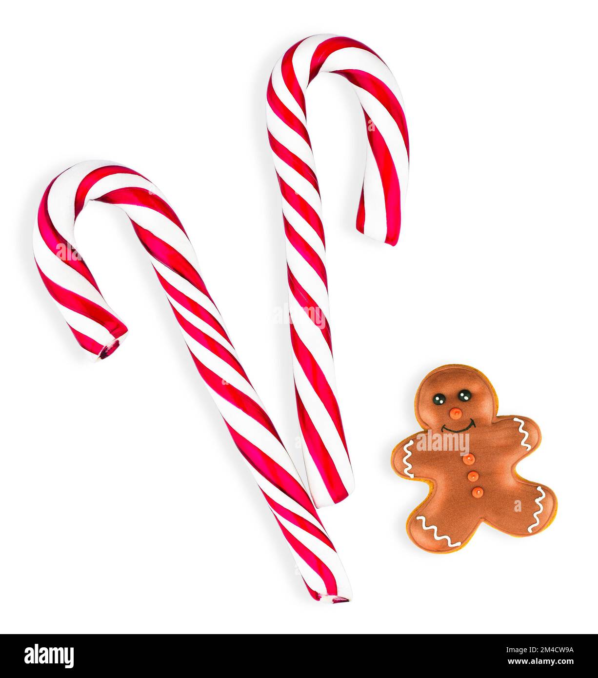 Two candies striped in Christmas colours and one chocolate smiling ...