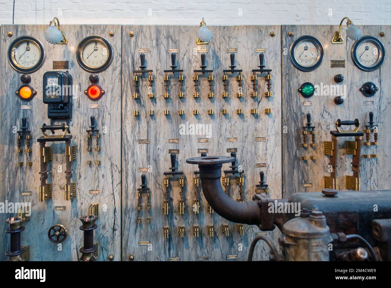 20th century electric switchboard showing switches, gauges and meters ...
