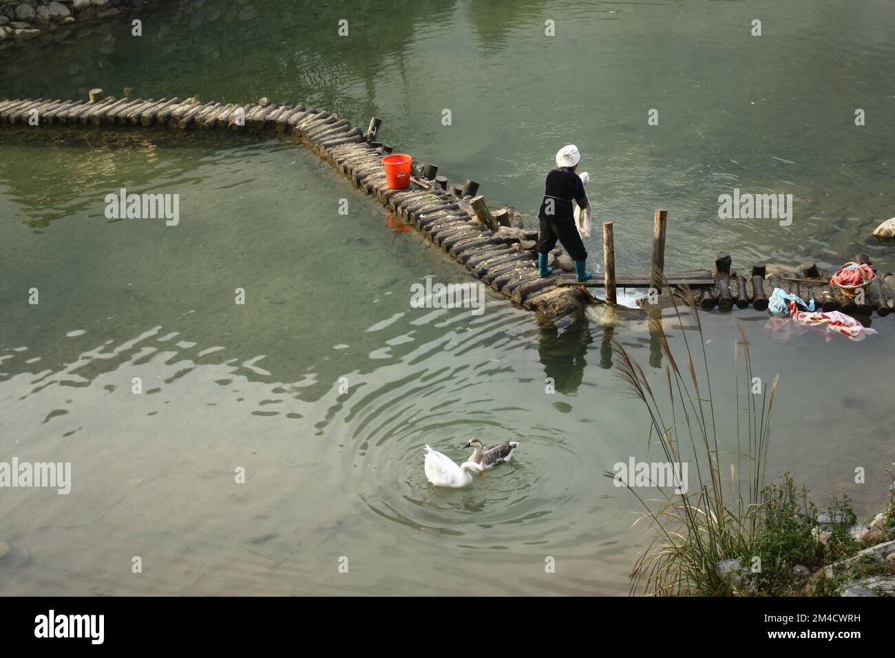 daily life of a women in the village get the early washing done Stock ...