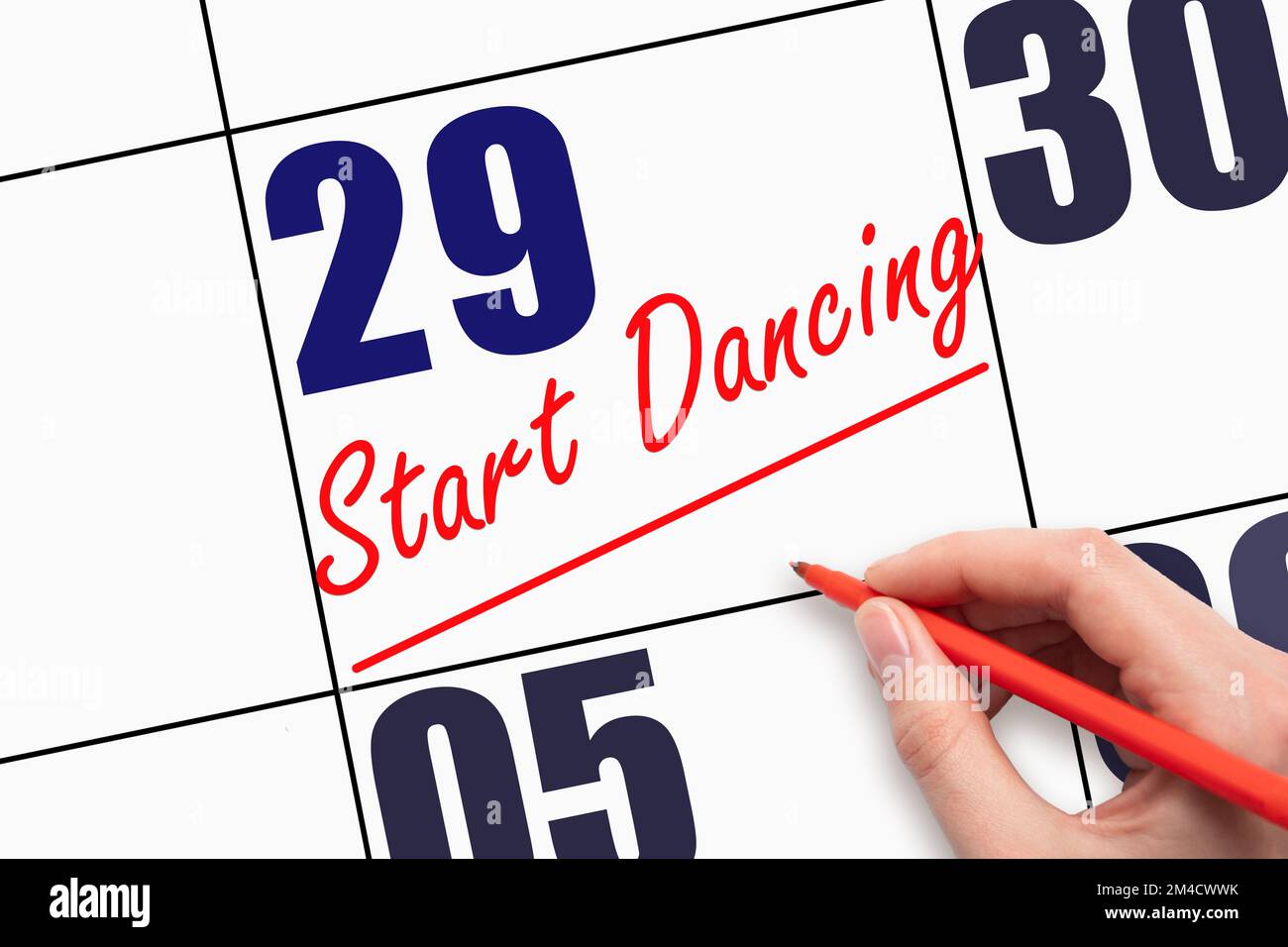 29th day of the month. Hand writing text START DANCING and drawing a ...