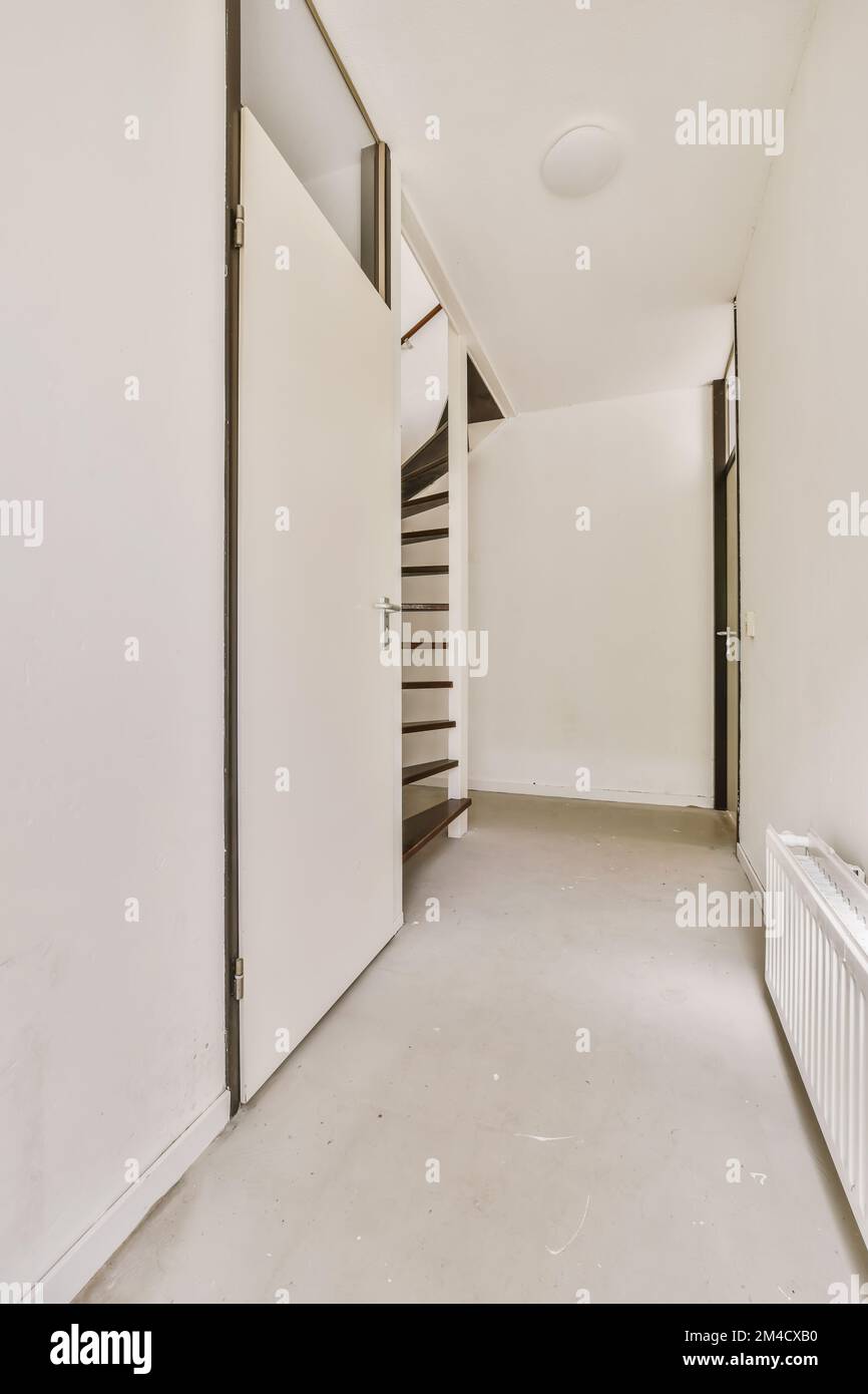 an empty room with white walls and no one person standing in the ...