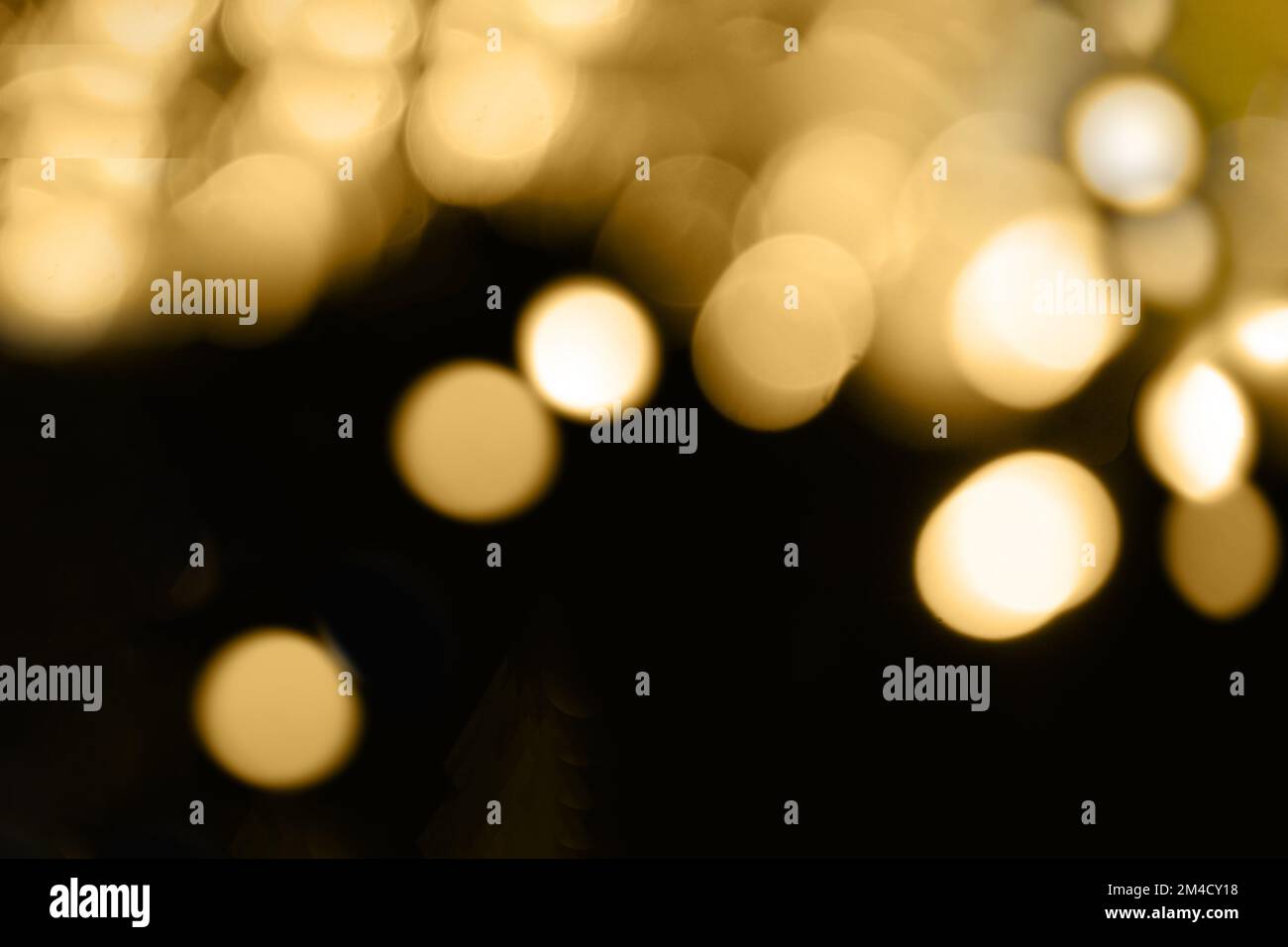 Blurry garland lights on a dark background. Festive Christmas and New ...