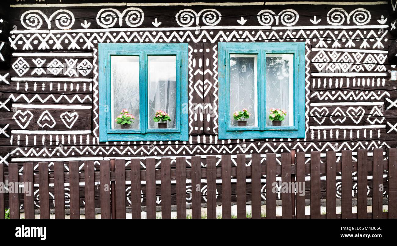 Two blue wooden windows on the White and black pattern ornament ...