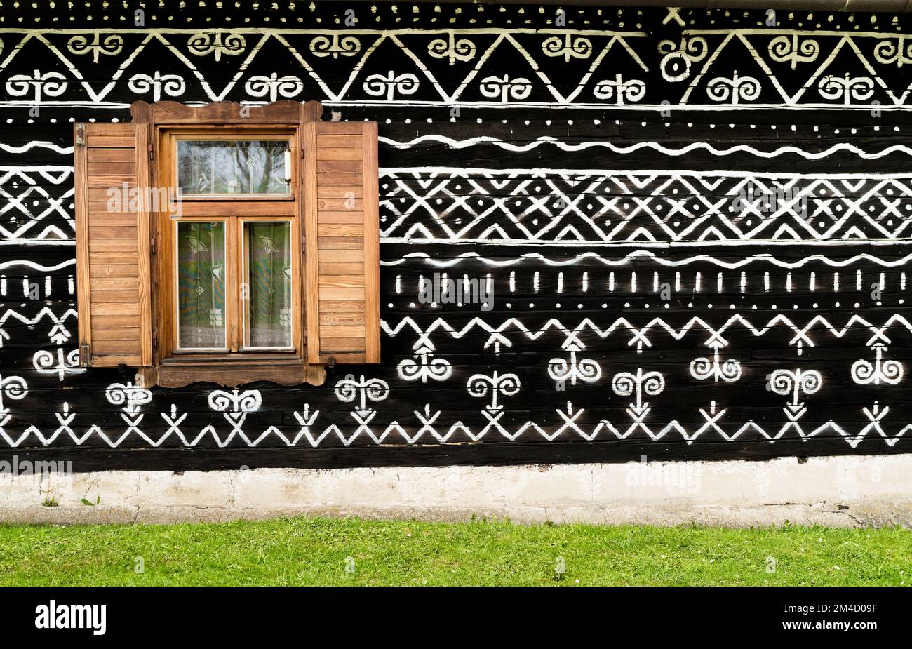 Wooden window on the White and black pattern ornament painting on the ...