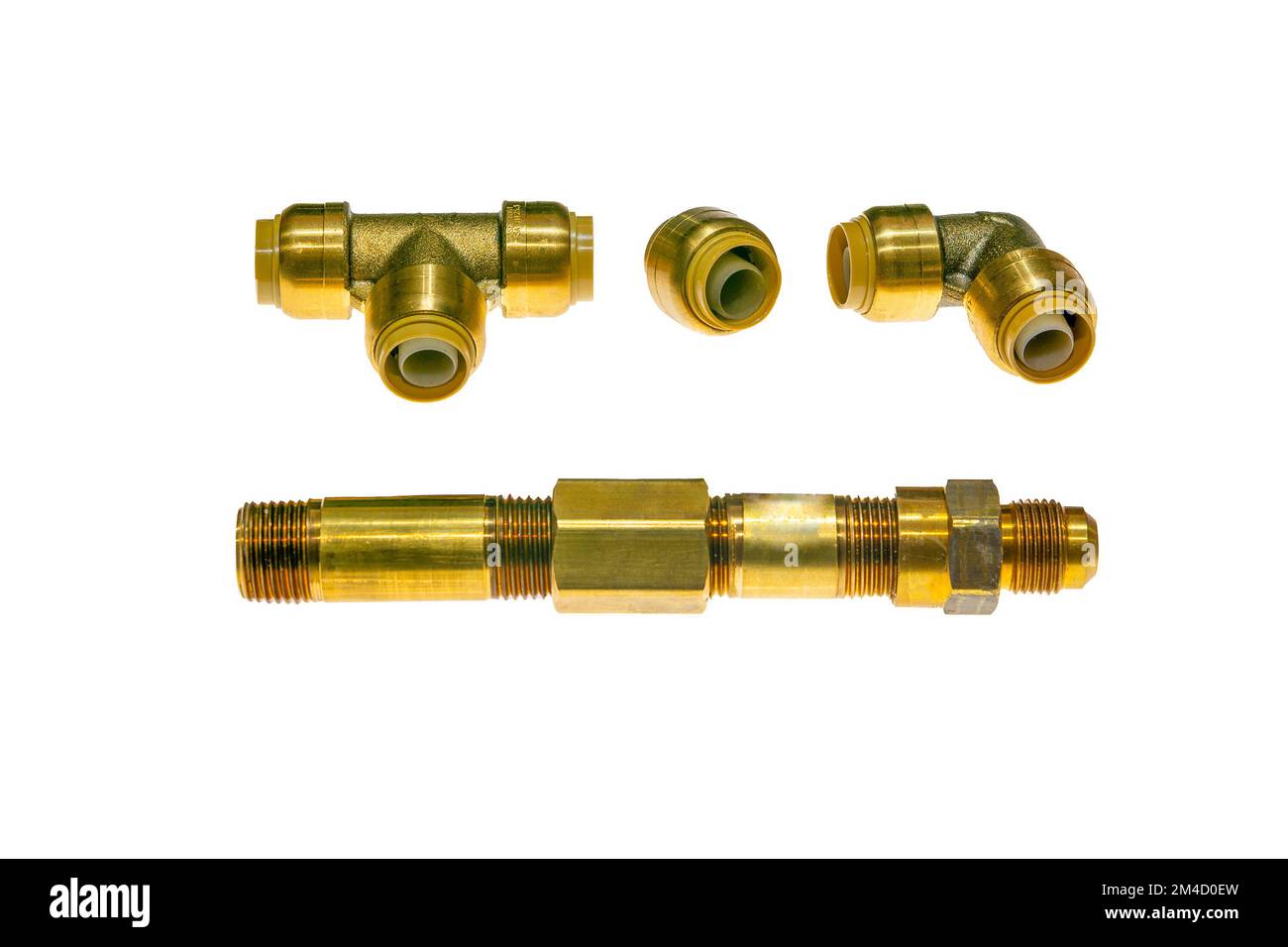 Brass plumbing parts, pipes, elbows, corners and plugs on a white ...