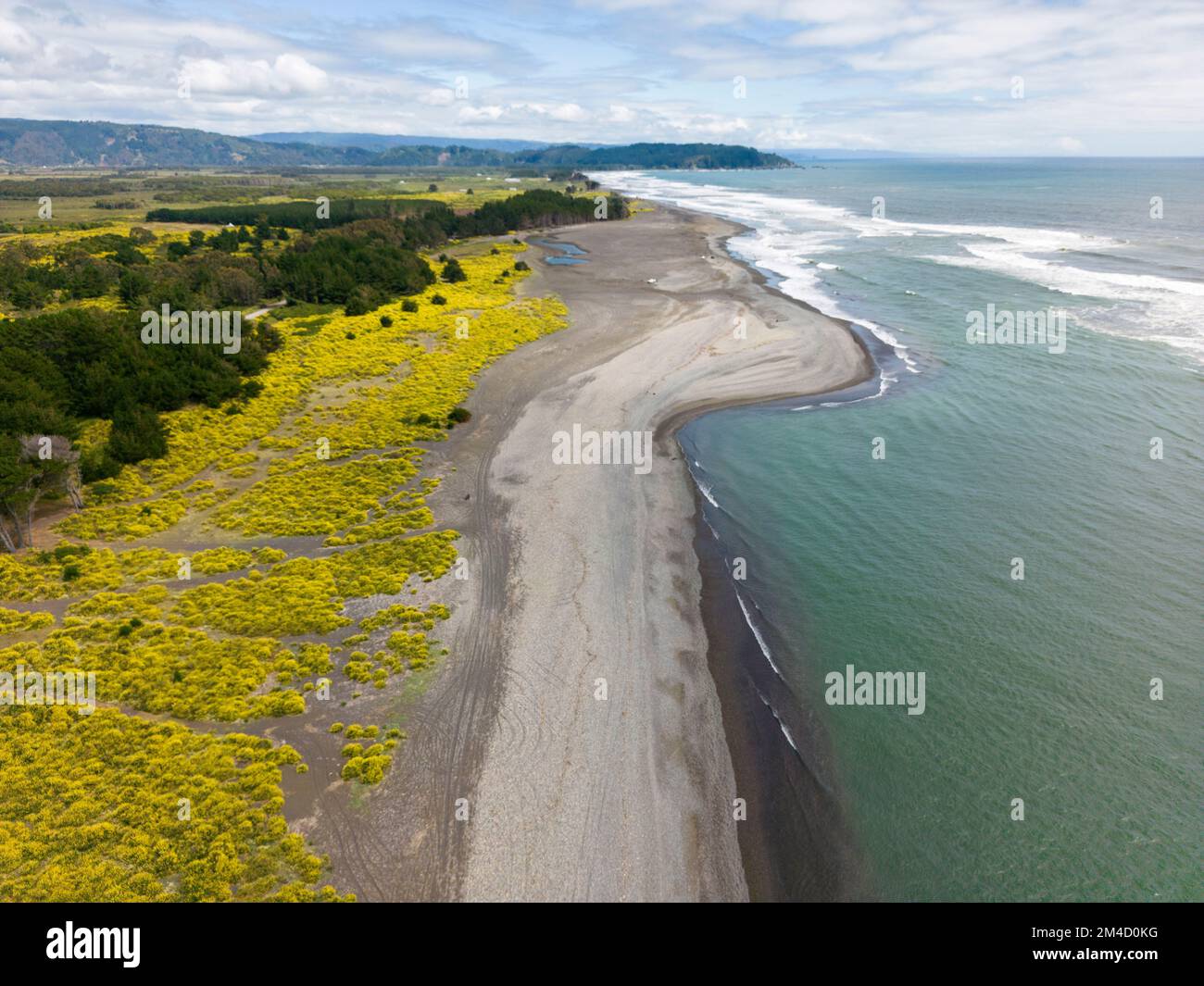 Aerial shot of the point where the river Tolten flows into the pacific ...