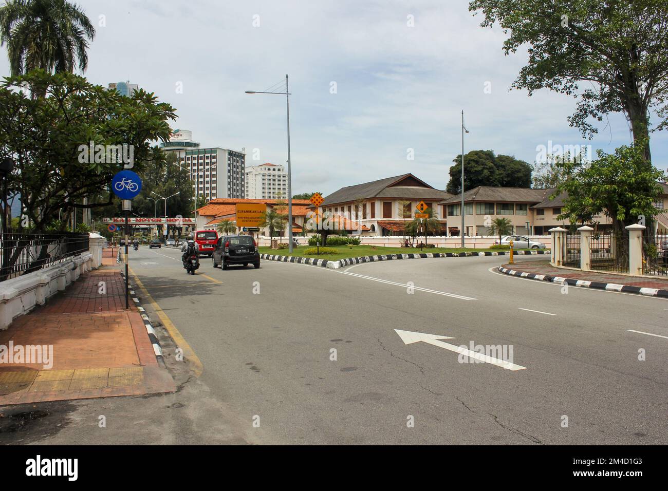 Georgetown, Penang, Malaysia - November 2012: A street lined with vintage Chinese shophouses in ...