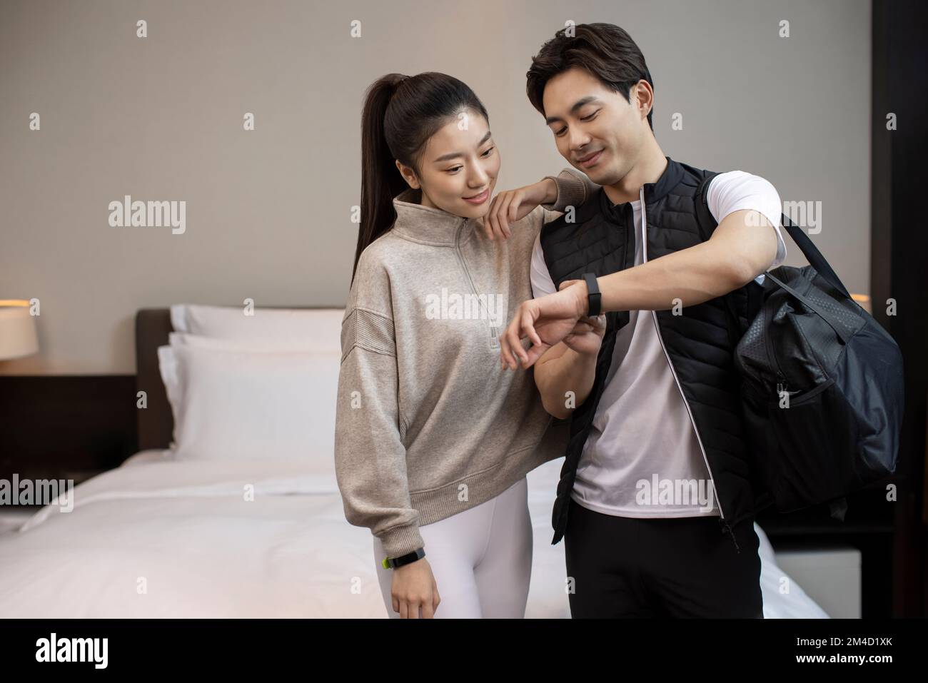 Young Chinese couple getting ready to go out and workout Stock Photo ...