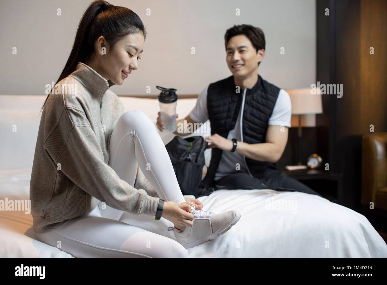 Young Chinese couple getting ready to go out and workout Stock Photo ...