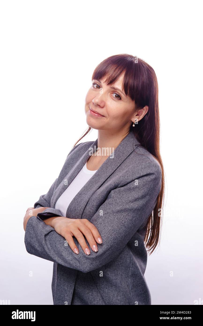 A brunette in a gray suit on a white background. Female business ...