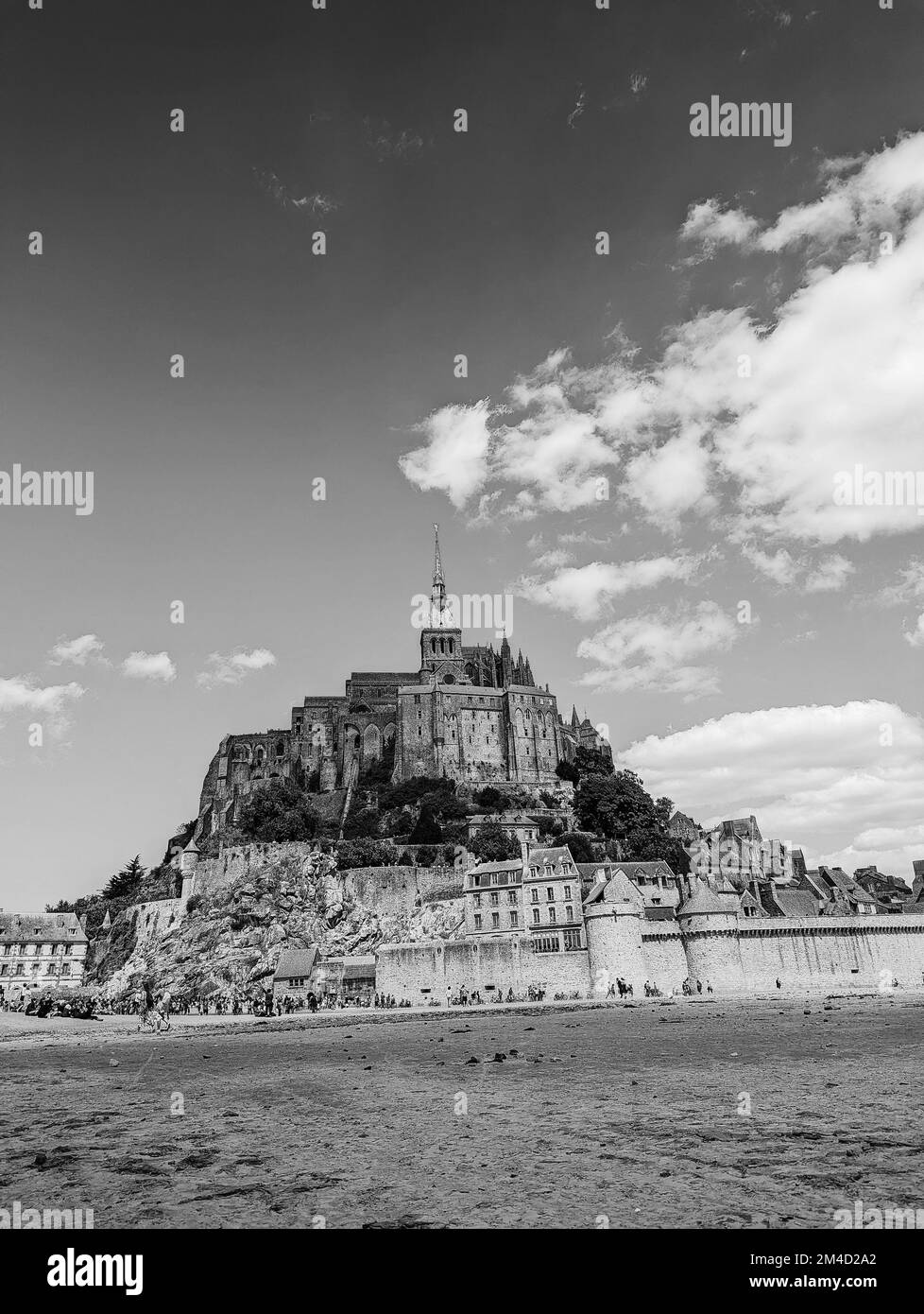 A grayscale vertical shot of Mont Saint Michel in Normandy, France ...