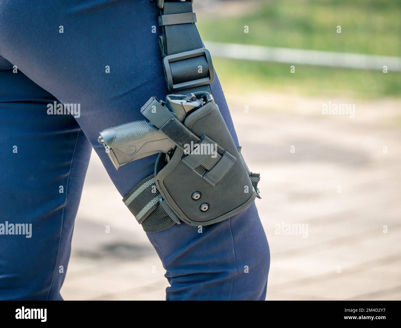 The gun or pistol of a romanian police officer in holster. Close up ...