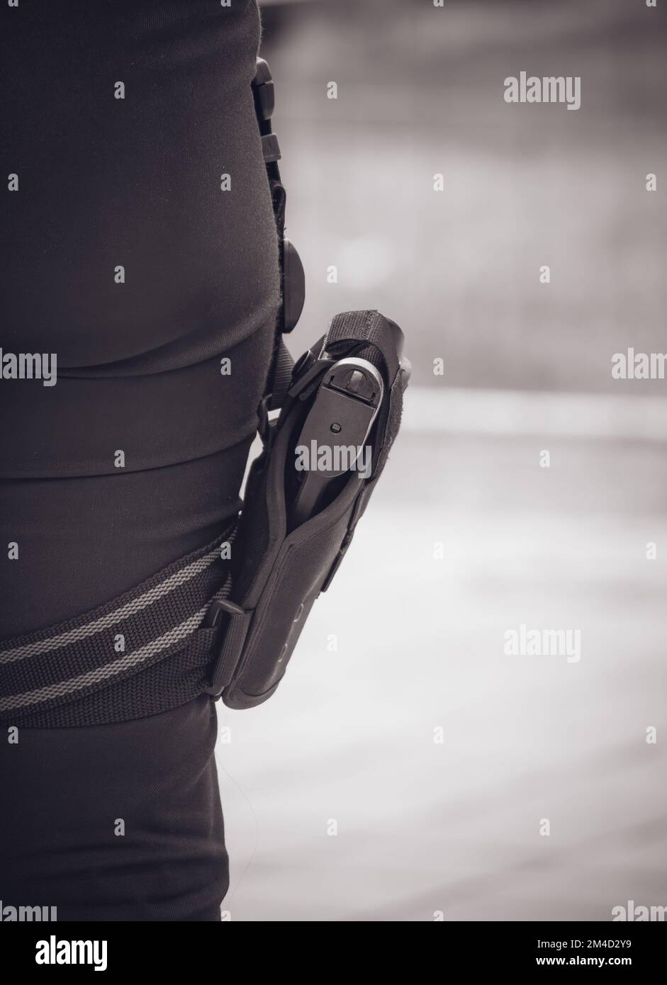 The gun or pistol of a romanian police officer in holster. Close up ...