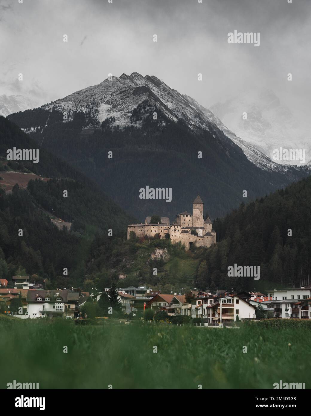 The Taufers castle on a hille surrounded with the majestic Dolomite ...