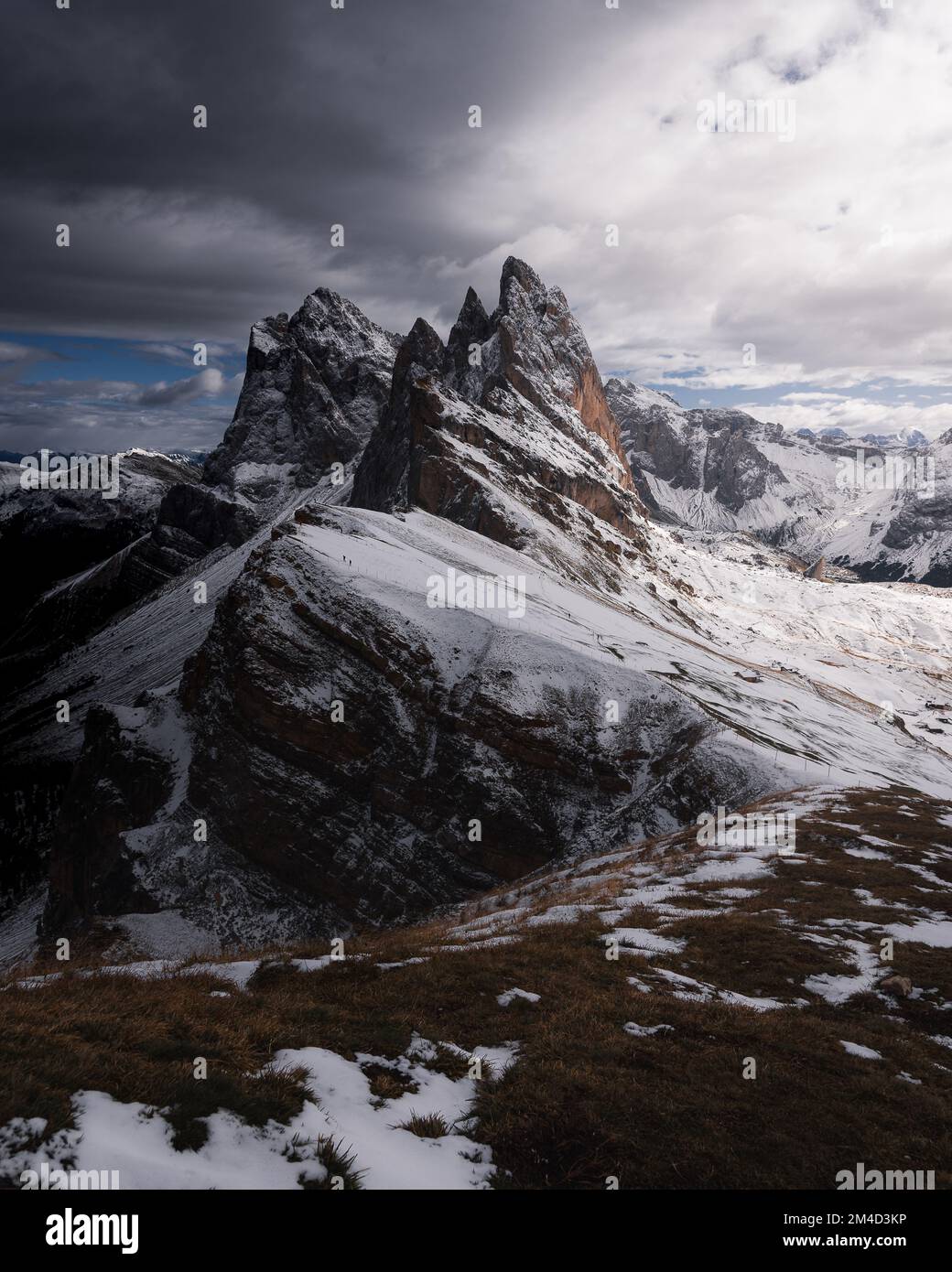 A vertical shot of the jagged peak of Seceda mountain in the Dolomite ...