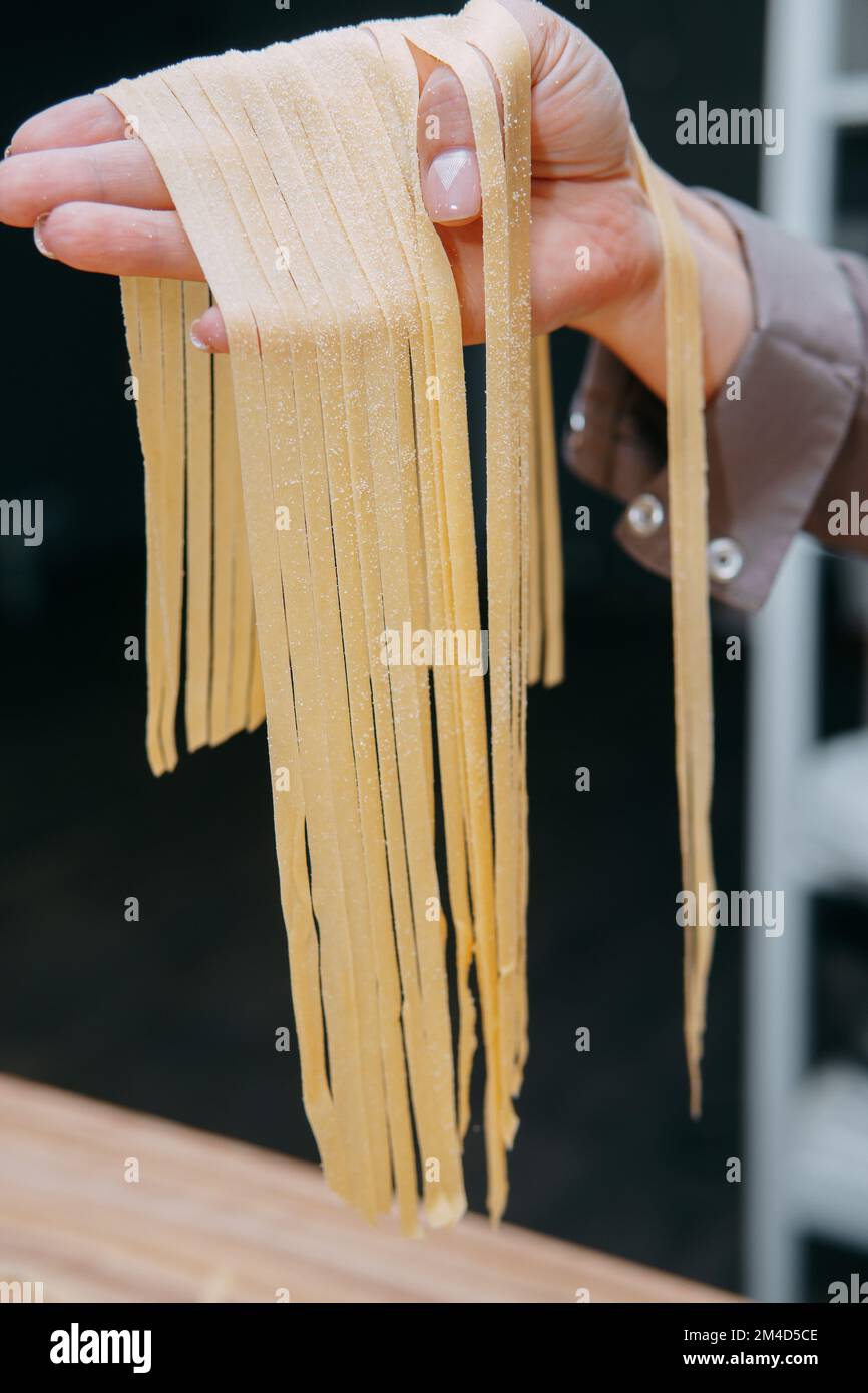 Cooking homemade pasta with your own hands. Cooking pasta at a cooking ...