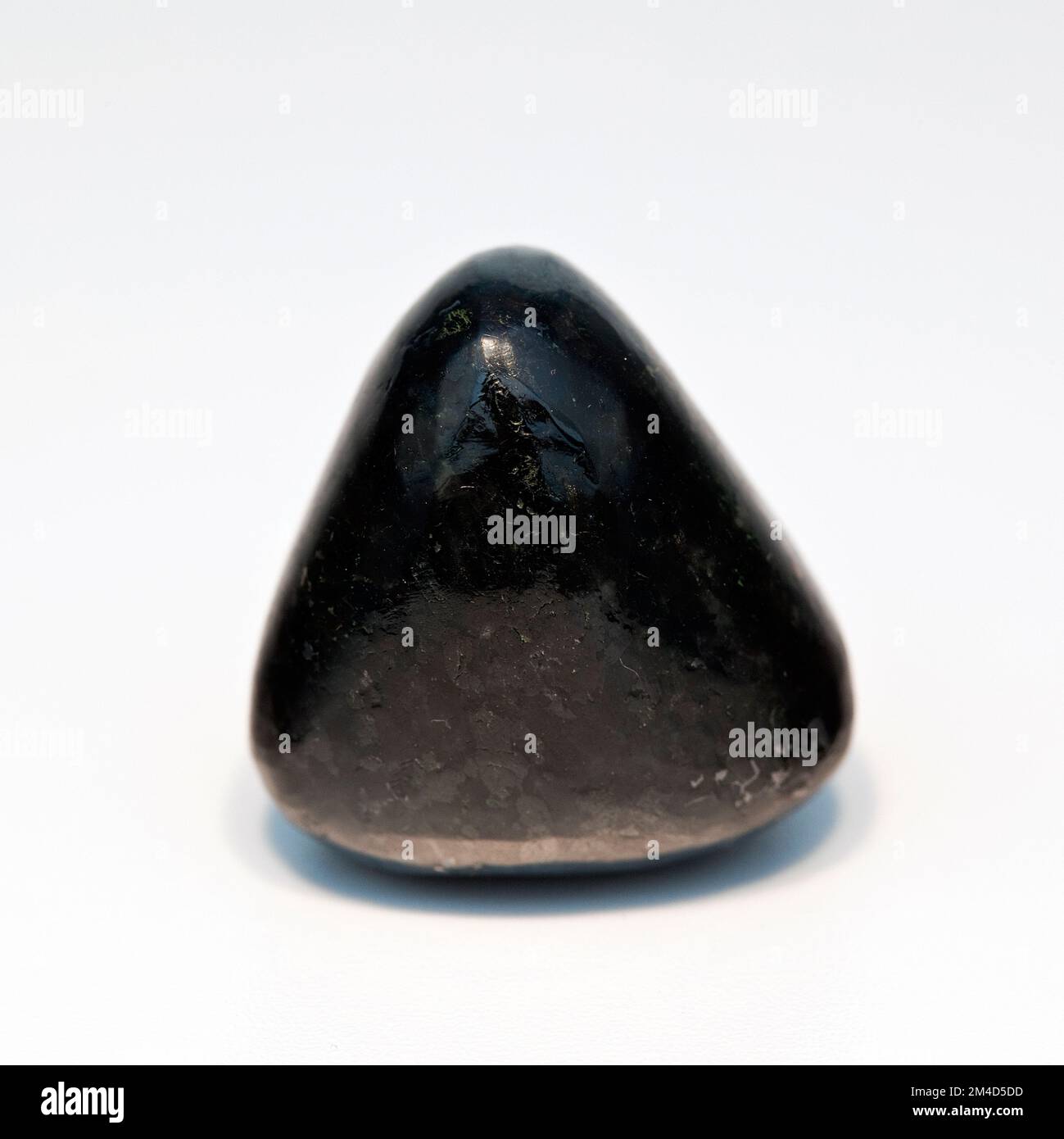 Macro shot a close up colour photograph of a polished 'Nuummite' a semi ...