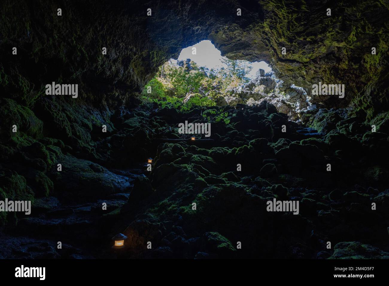 Entrance of a volcanic cave in the Volcanic Caves Park at the foot of ...