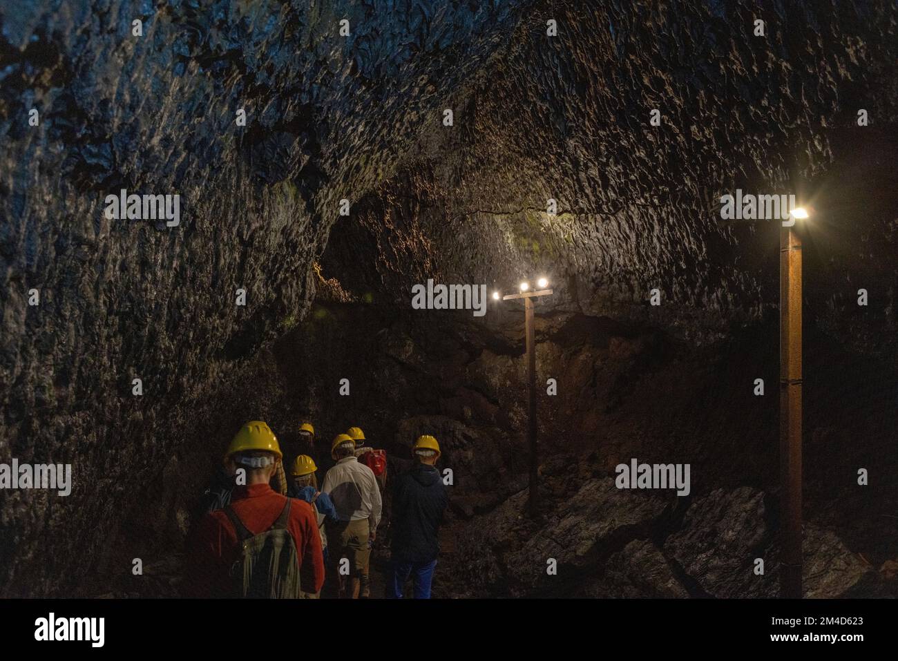 Exploring a volcanic cave in the Volcanic Caves Park at the foot of ...