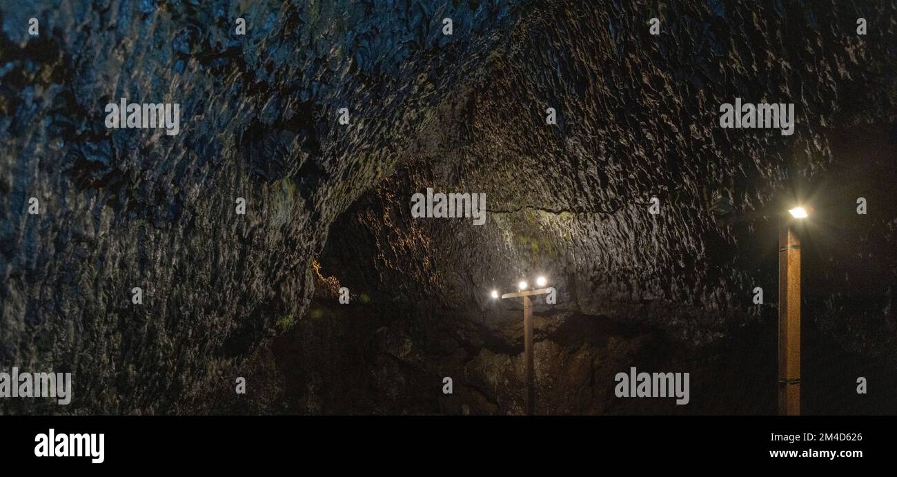 Exploring a volcanic cave in the Volcanic Caves Park at the foot of ...