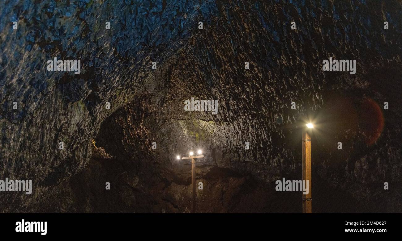 Exploring a volcanic cave in the Volcanic Caves Park at the foot of ...