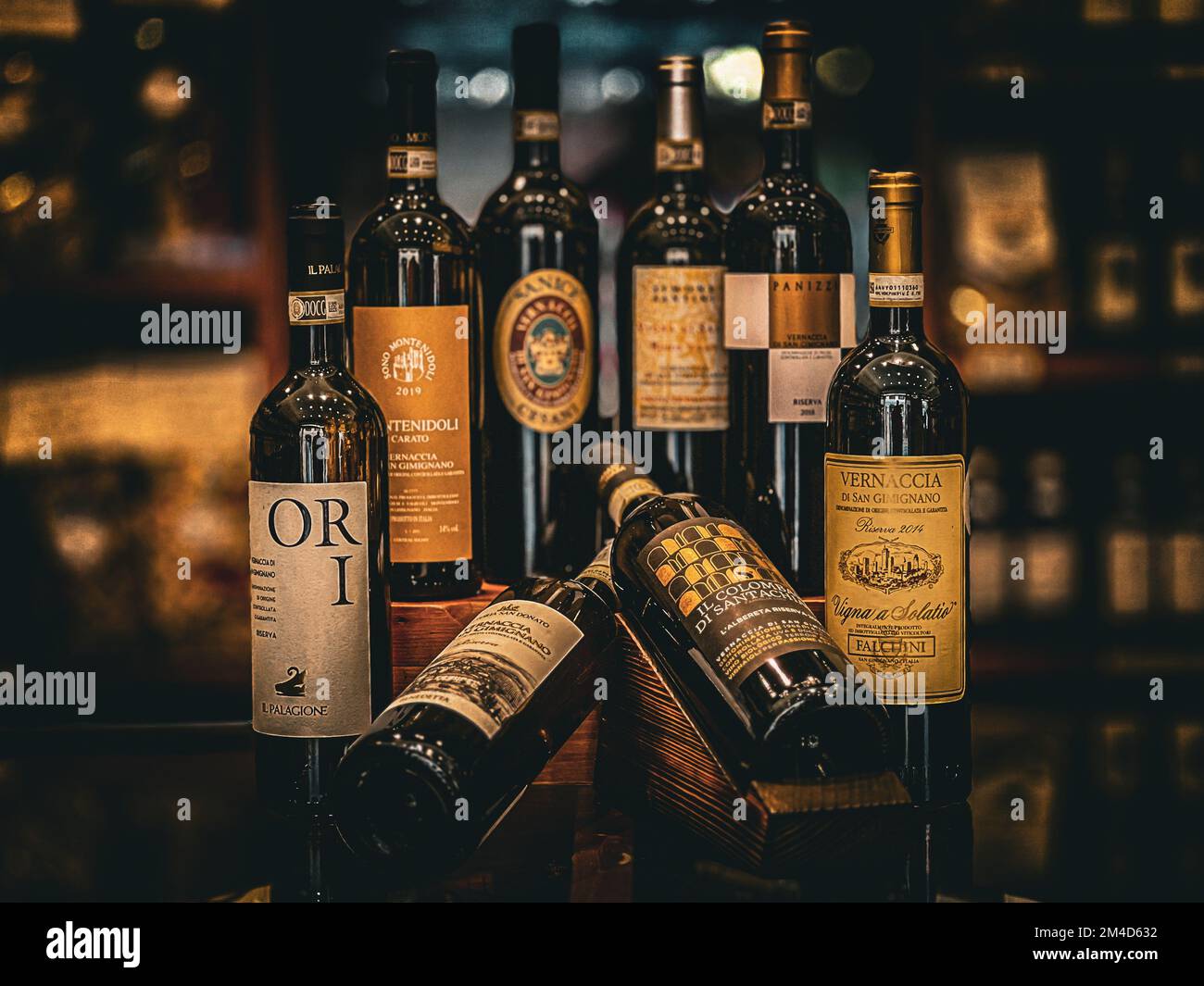 A pile of wine bottles from different Italian brands captured in a ...