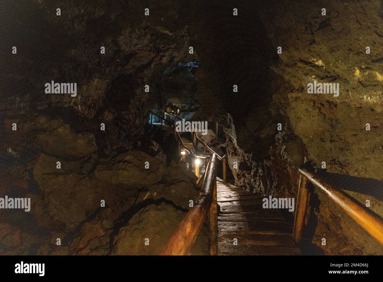 Exploring a volcanic cave in the Volcanic Caves Park at the foot of ...