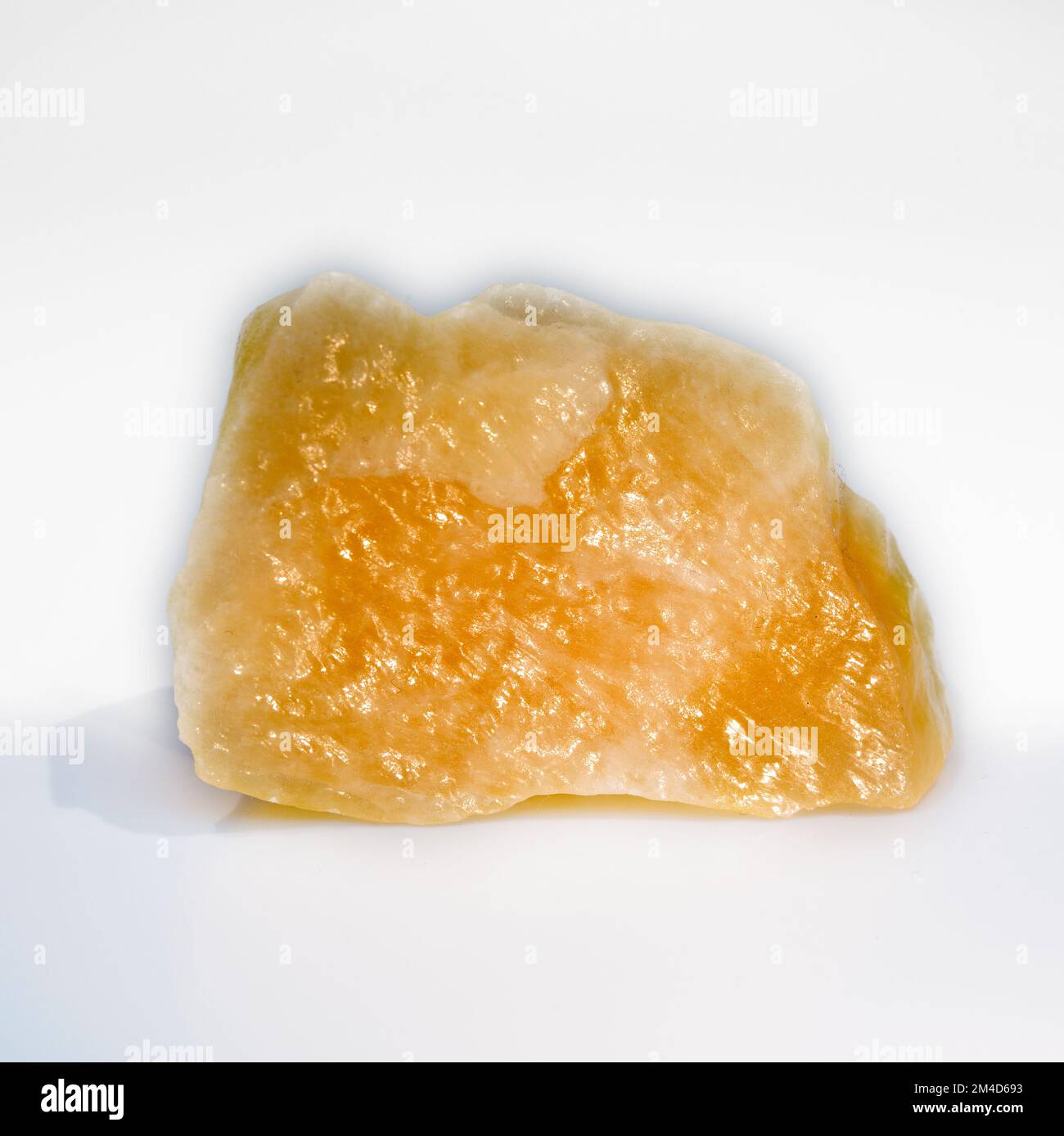 Macro close up colour photograph of a natural " Orange Calcite " a semi ...