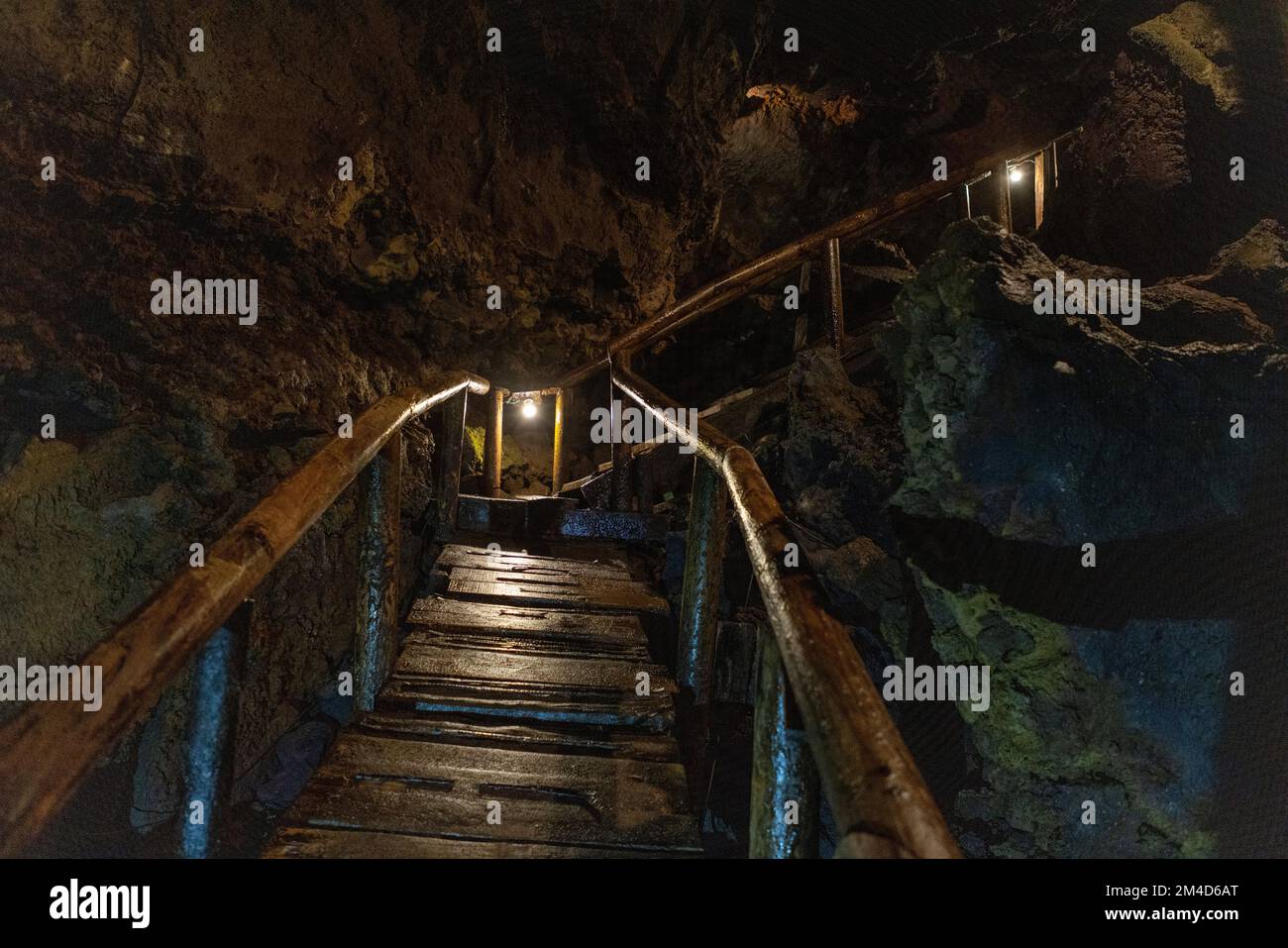 Exploring a volcanic cave in the Volcanic Caves Park at the foot of ...