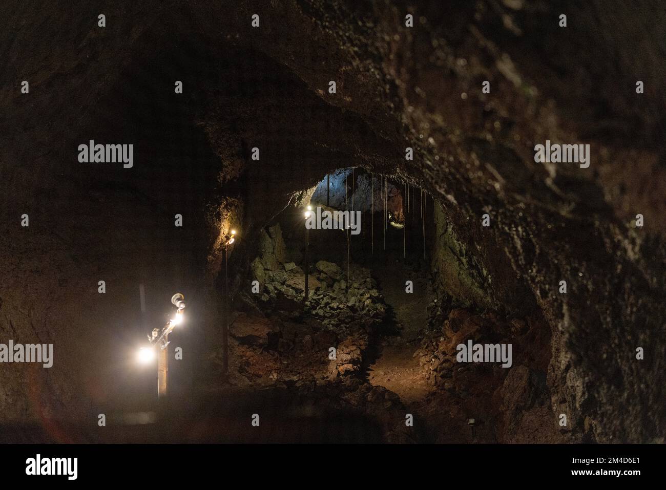 Exploring a volcanic cave in the Volcanic Caves Park at the foot of ...