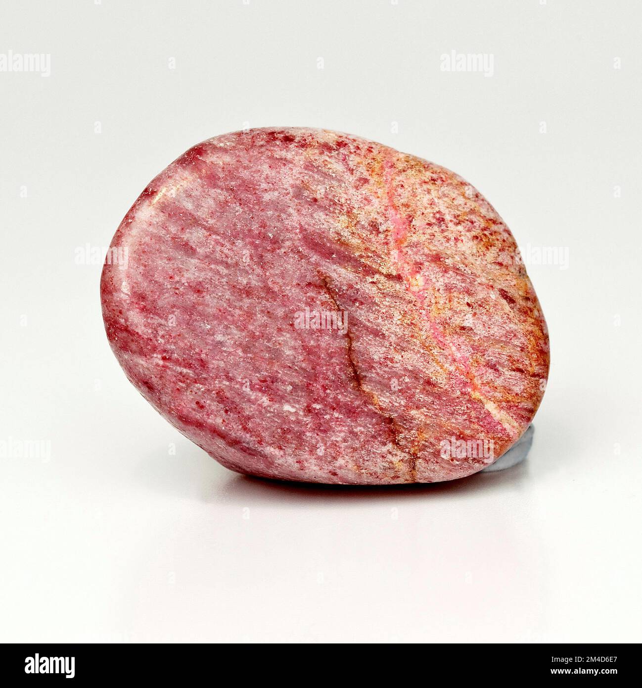 Macro close up colour photograph of 'Thulite' a semi precious crystal ...