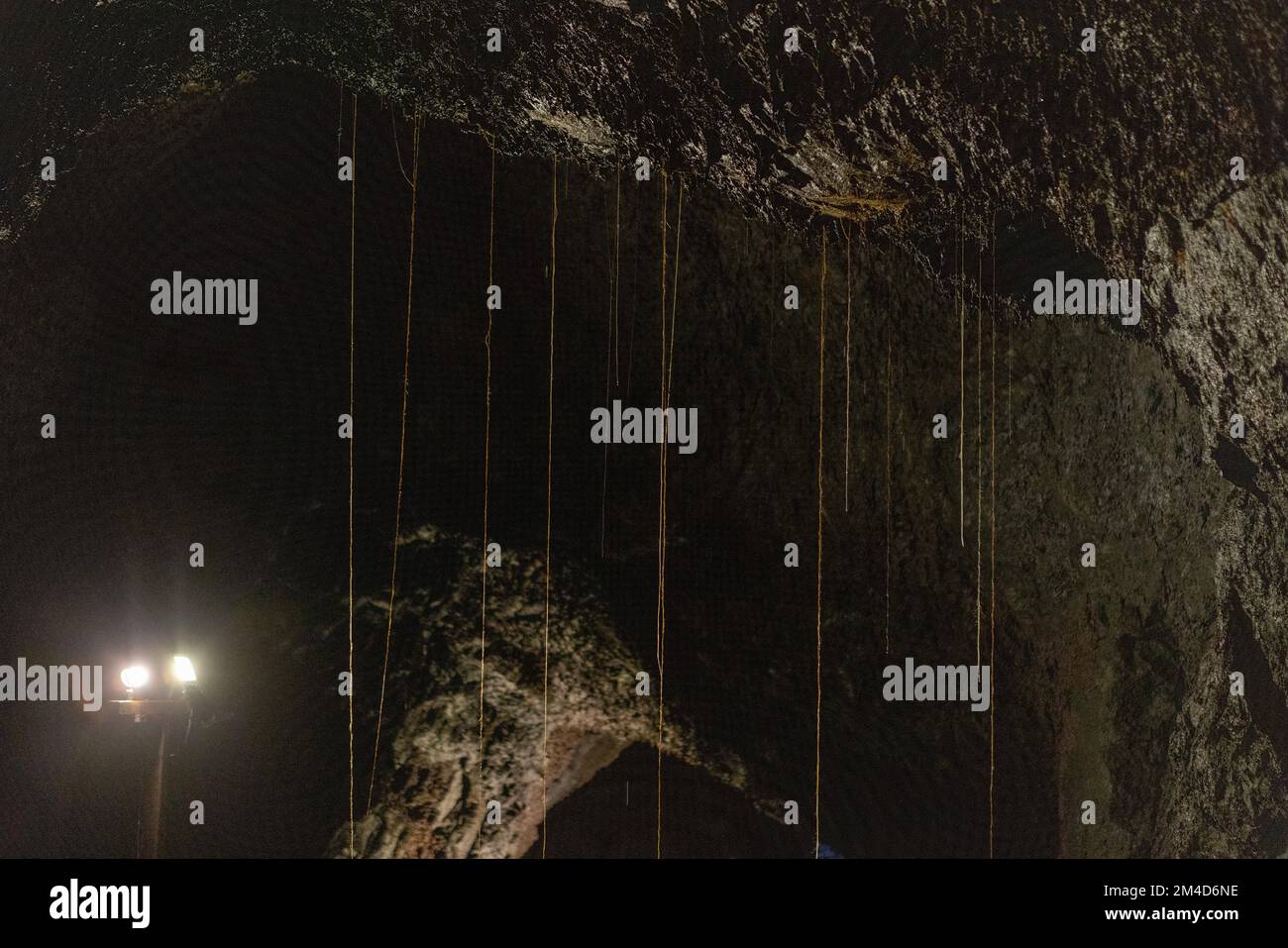 Exploring a volcanic cave in the Volcanic Caves Park at the foot of ...