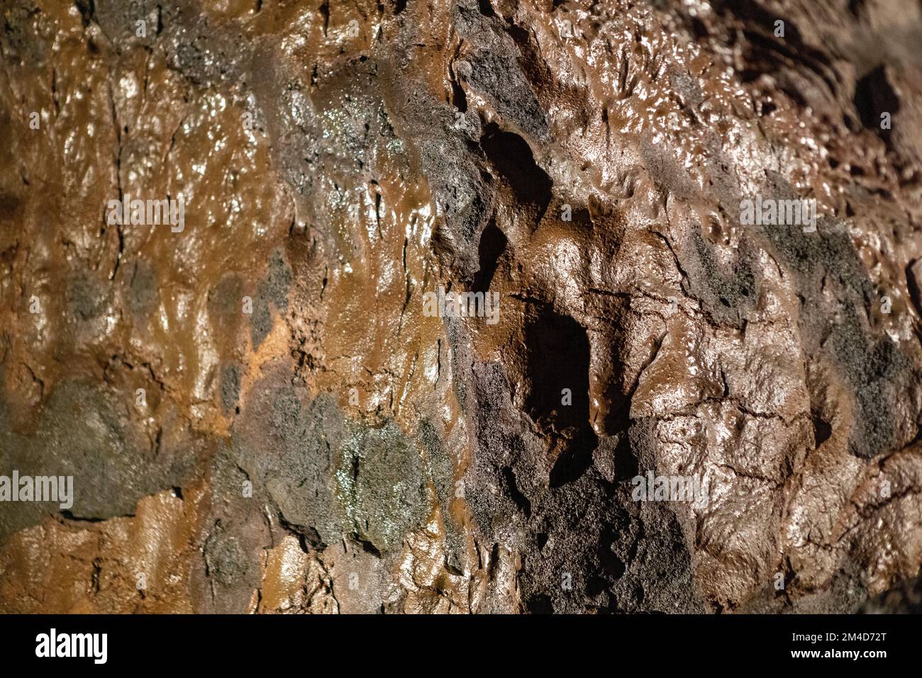 Exploring a volcanic cave in the Volcanic Caves Park at the foot of ...
