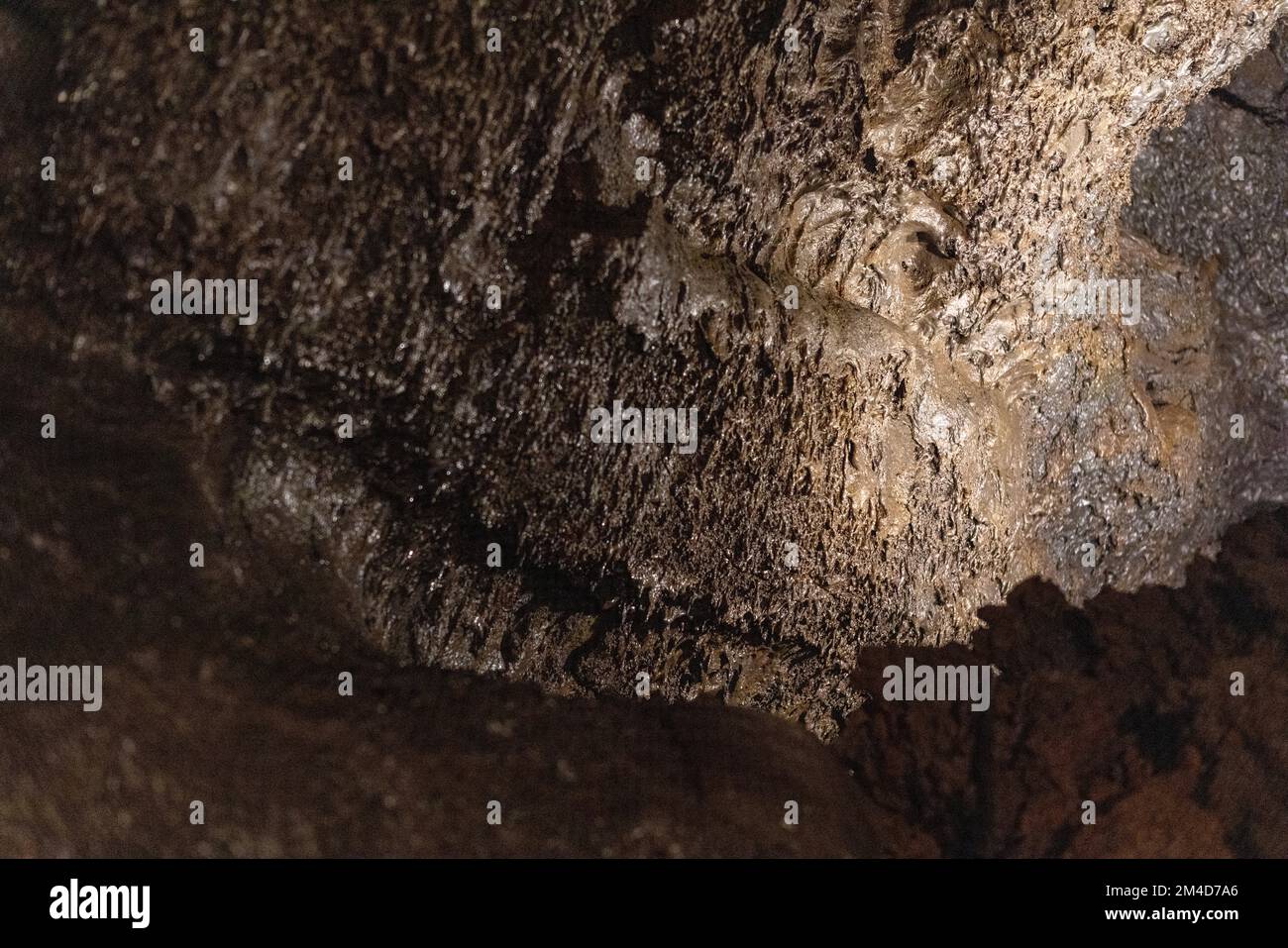 Exploring a volcanic cave in the Volcanic Caves Park at the foot of ...