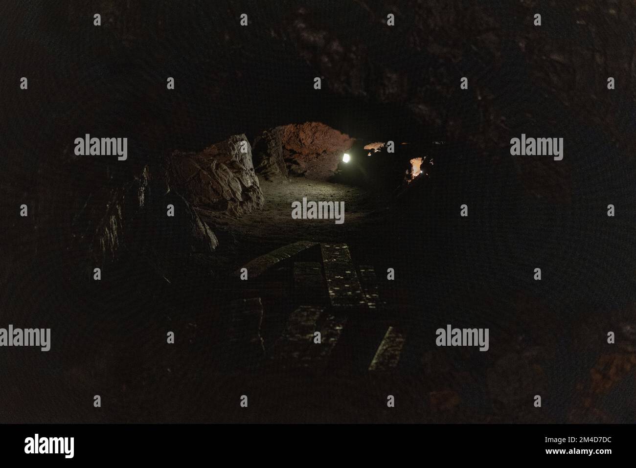 Exploring a volcanic cave in the Volcanic Caves Park at the foot of ...