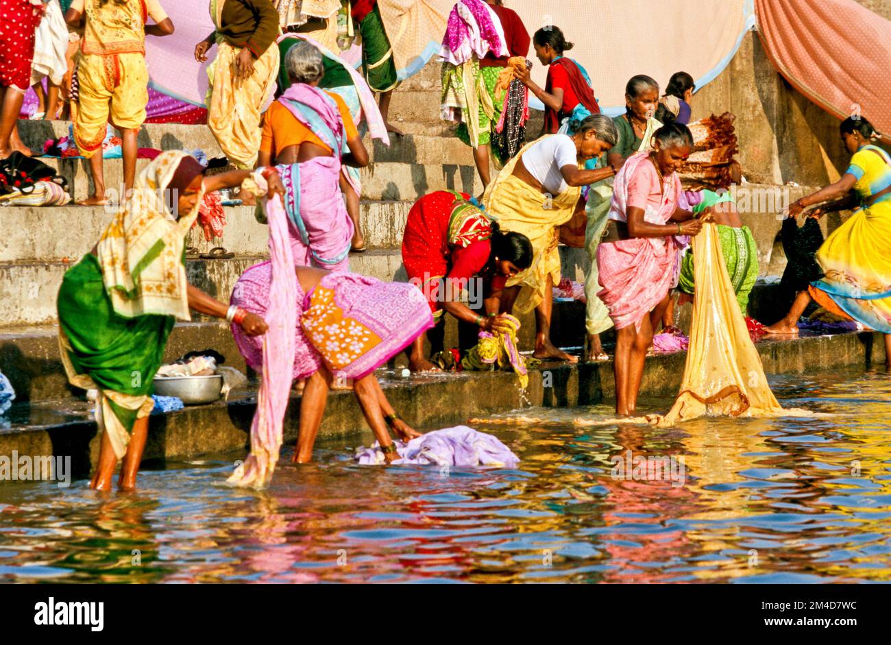 Indian woman washing clothes outside hi-res stock photography and ...