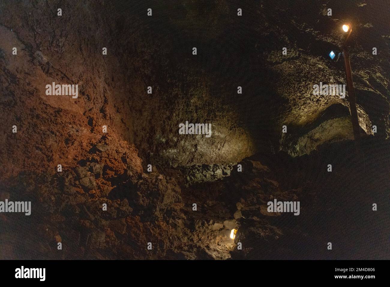 Exploring a volcanic cave in the Volcanic Caves Park at the foot of ...