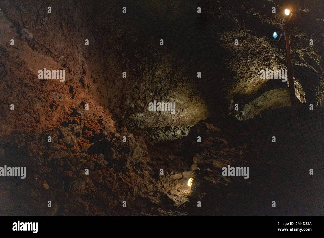 Exploring a volcanic cave in the Volcanic Caves Park at the foot of ...