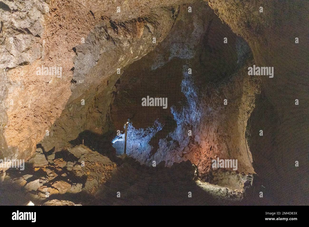 Exploring a volcanic cave in the Volcanic Caves Park at the foot of ...